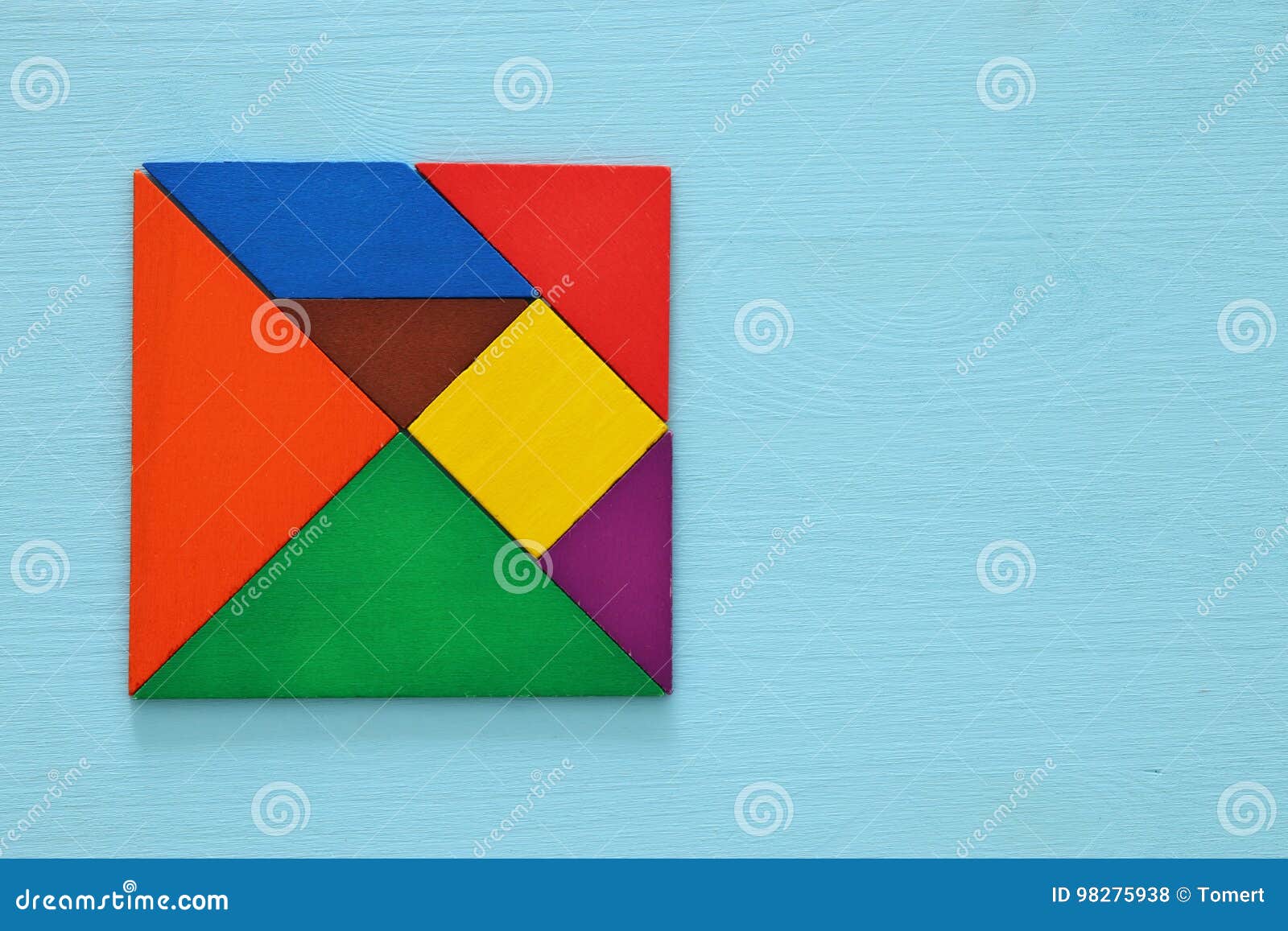 Tangram Puzzle In Parallelogram Shape On Wood Background Stock Photo ...