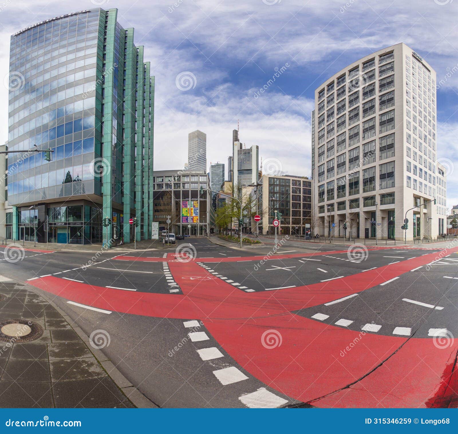 Image of a Road Junction with a Red Colored Cycle Path in Front of the ...