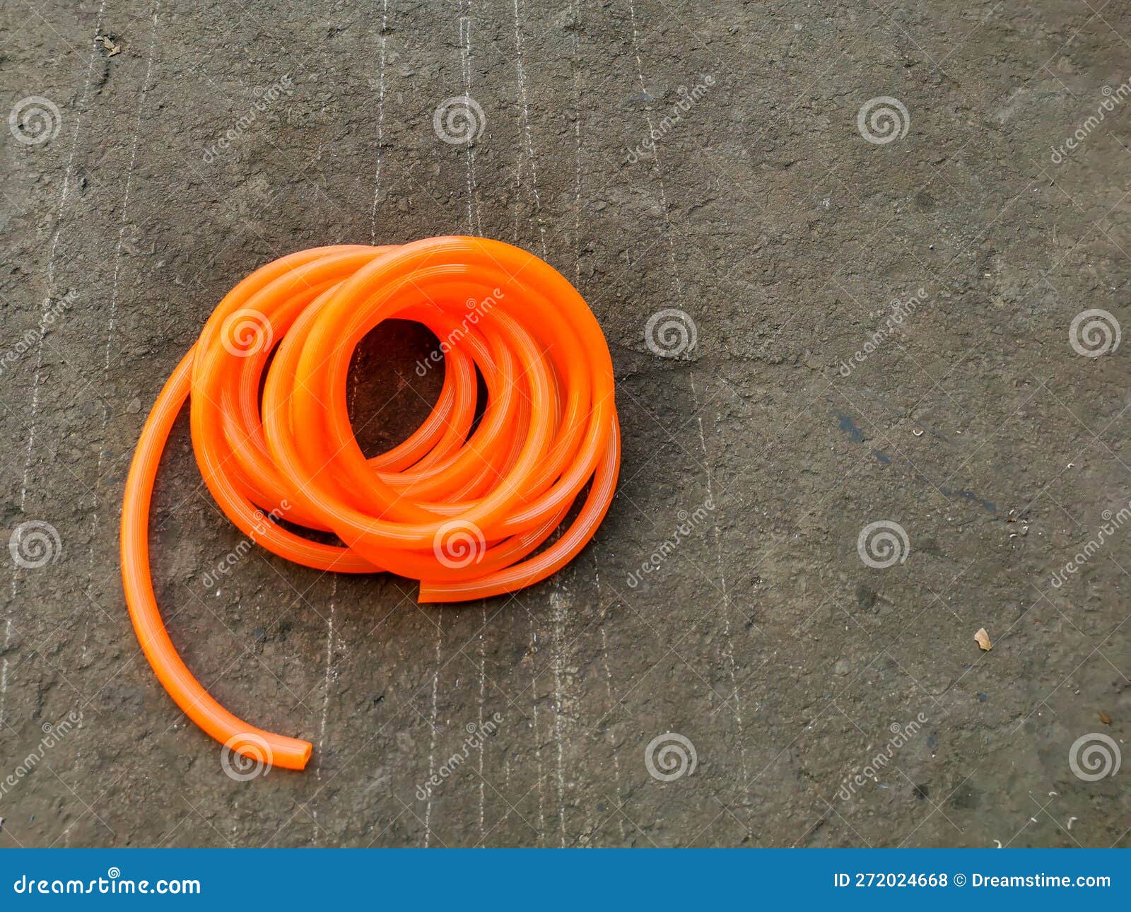 Image of Rubber Hose Coiled on the Ground. Stock Photo - Image of ...