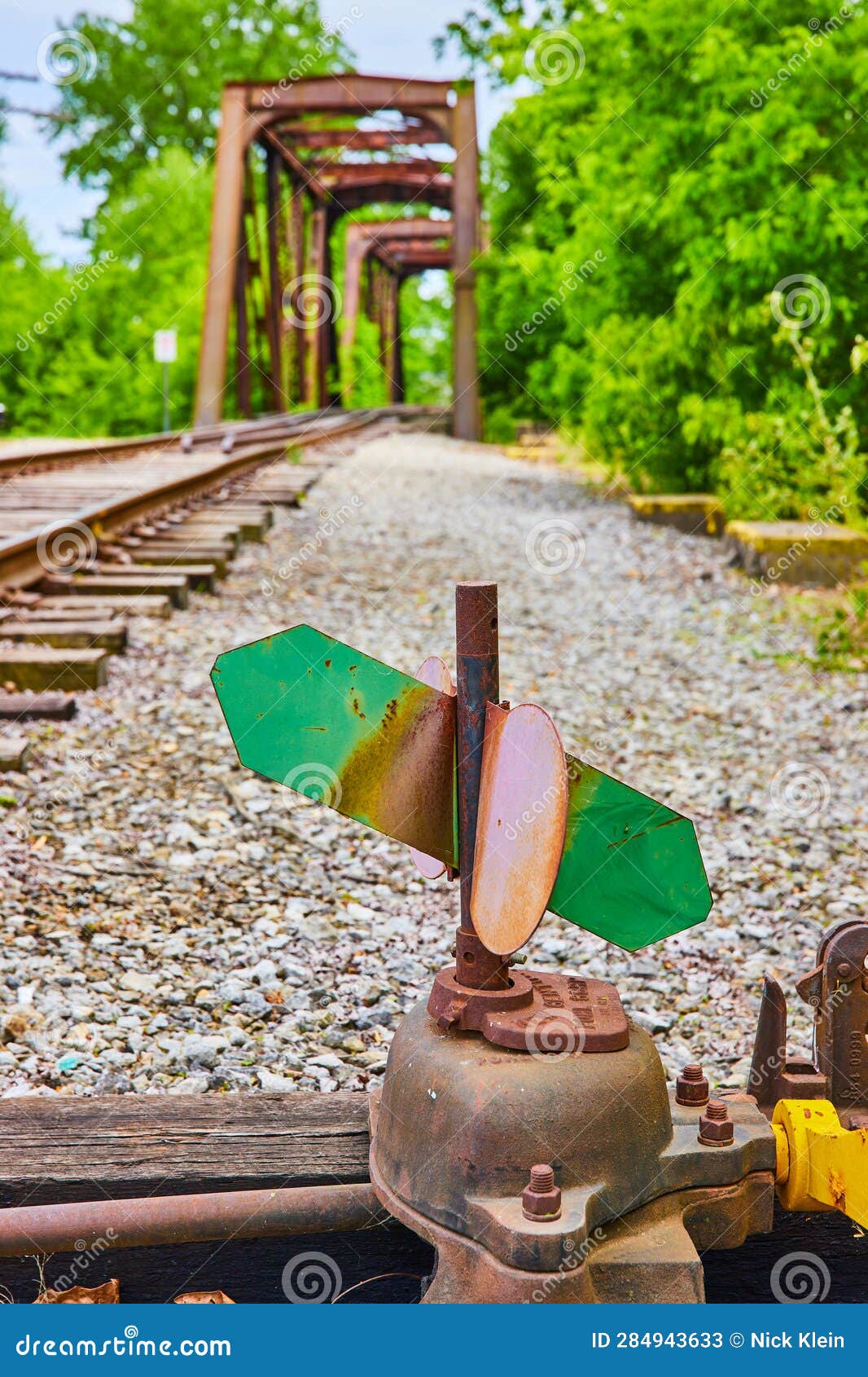 Rusty Railroad Switch with Green Paint and Yellow Lever on Train Tracks ...
