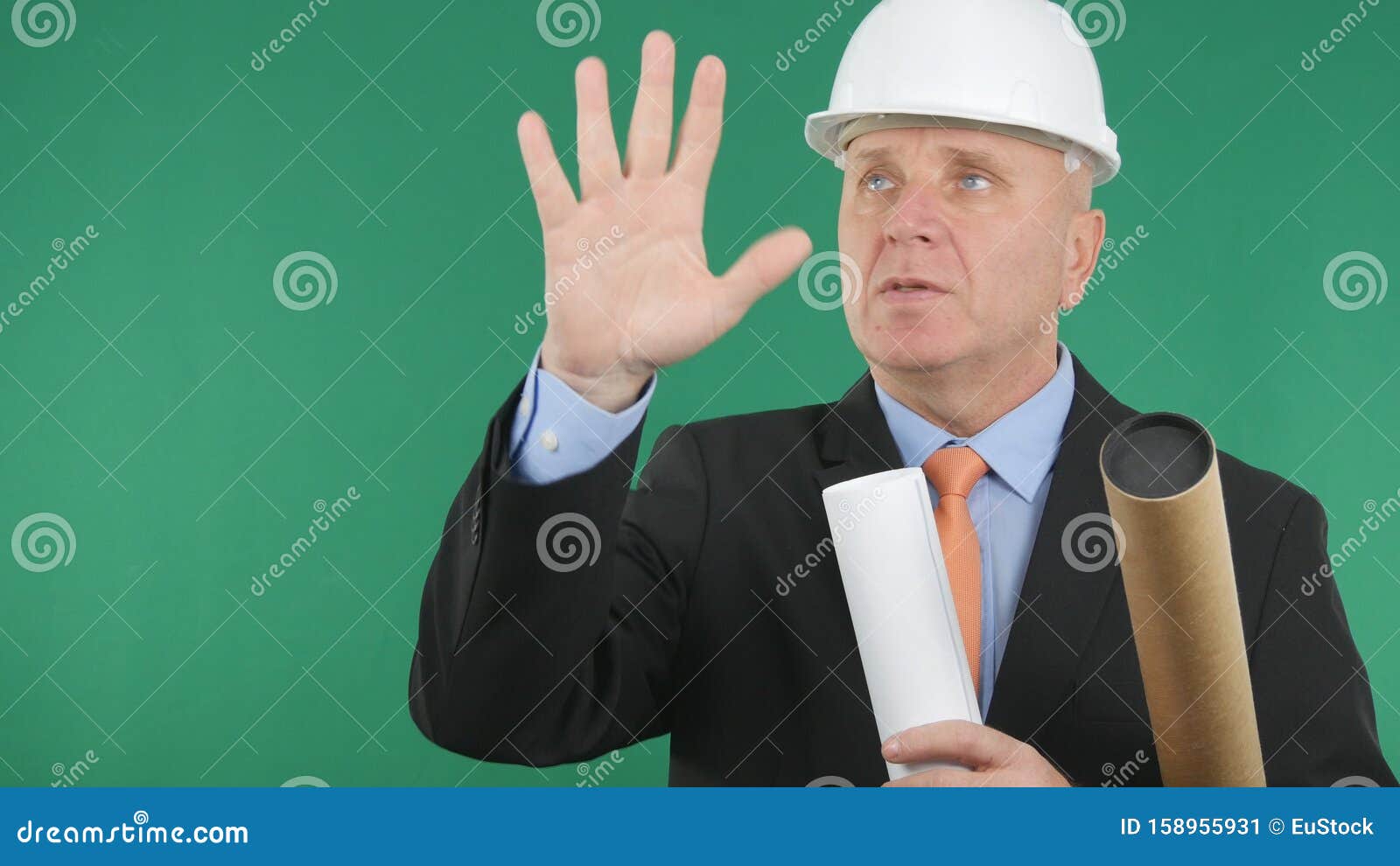 Image with Serious Engineer with Plans and Projects Making Hand ...