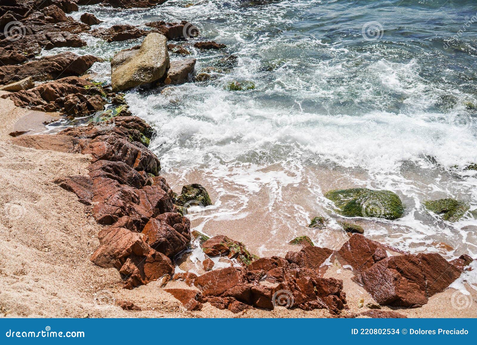 A Shore with Rocks and Sand on a Mediterranean Beach Stock Photo ...
