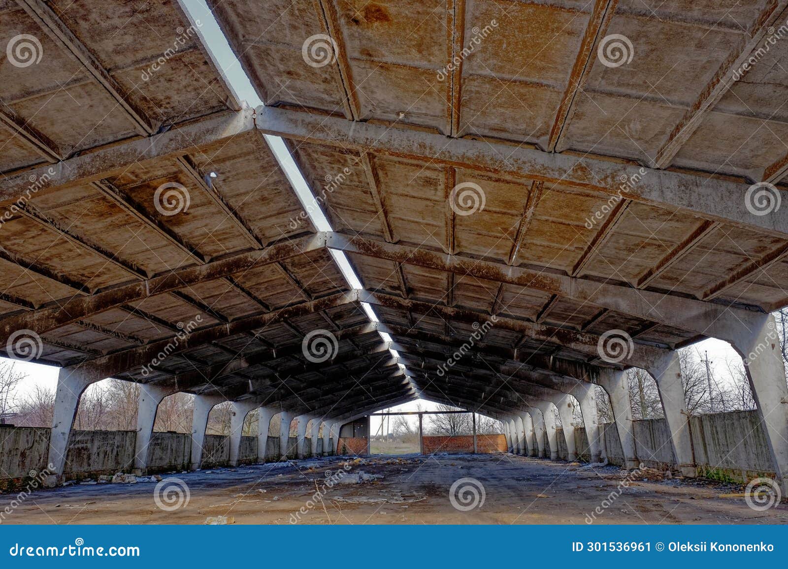 The Image Shows an Abandoned, Dilapidated Structure with a Series of ...