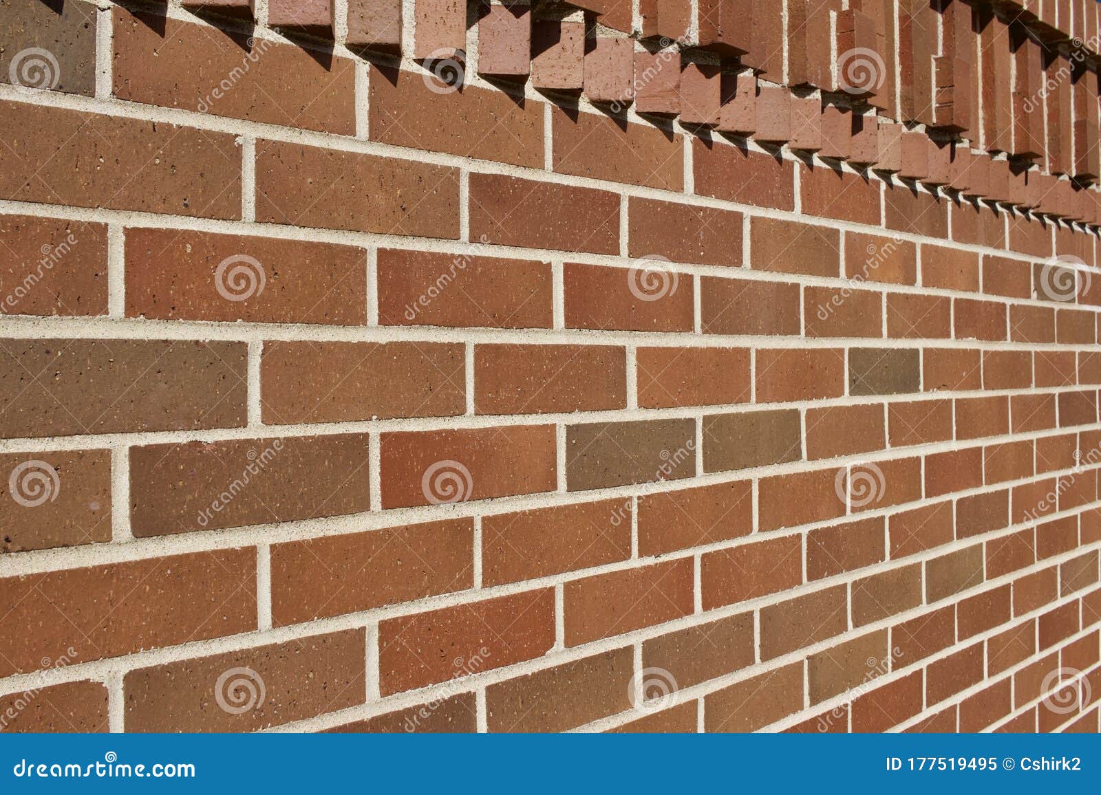 Brown Brick Wall Texture Background with Header of Protruding Bricks in ...