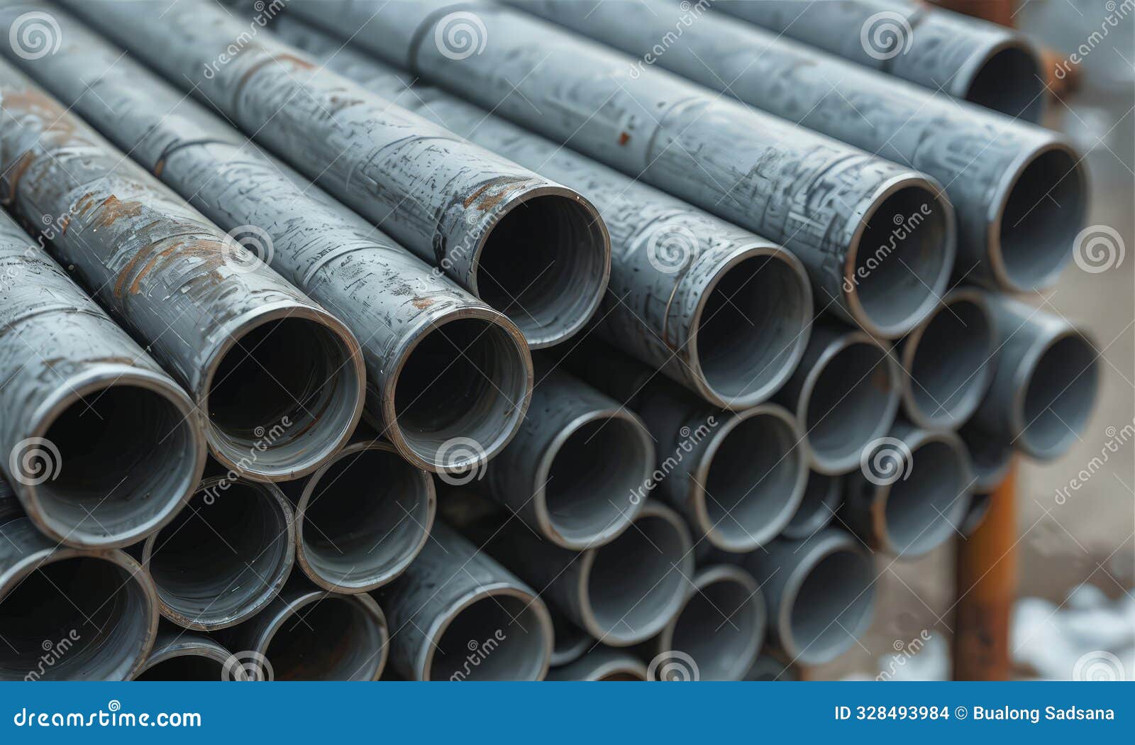 Stack Gray Metal Pipes with Visible Rust, Arranged in Pyramid-like ...