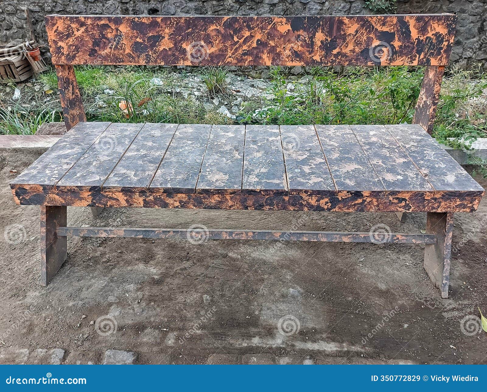 The Image Shows a Long Bench Made of Wood with an Abstract Motif in a ...