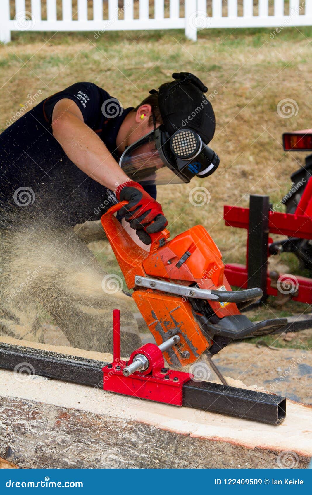 A Log Being Planked Using a Chain Saw. Editorial Stock Image - Image of ...