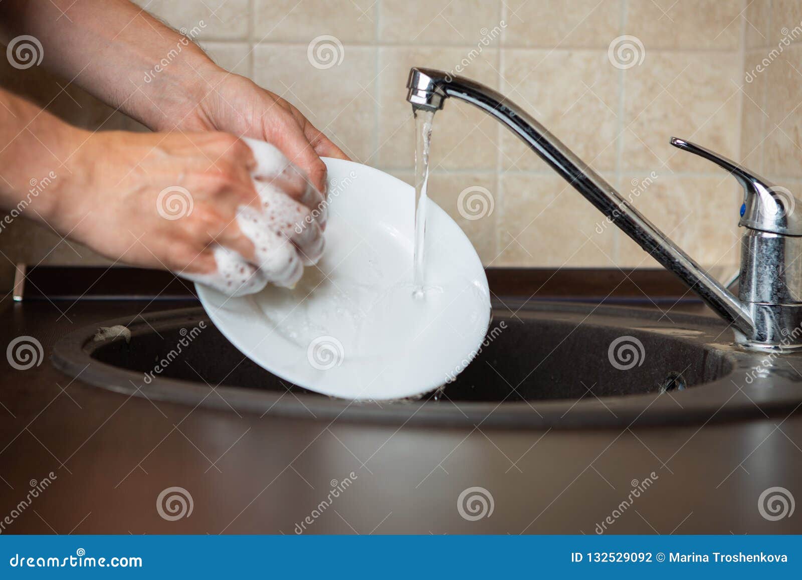 Image of Side of Man Washing White Plates Stock Photo - Image of ...