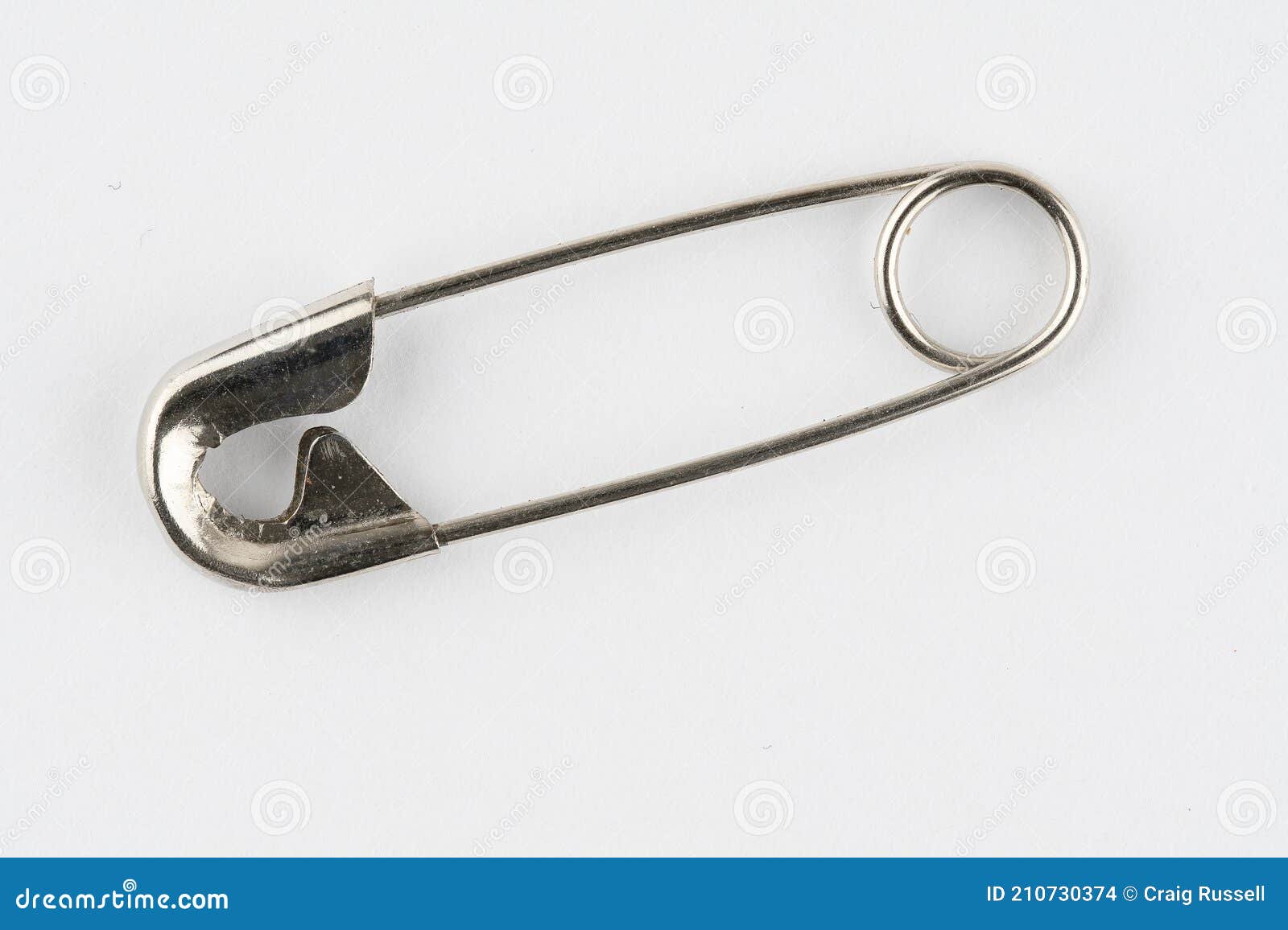 Image of a Single Closed Safety Pin Stock Photo - Image of background ...
