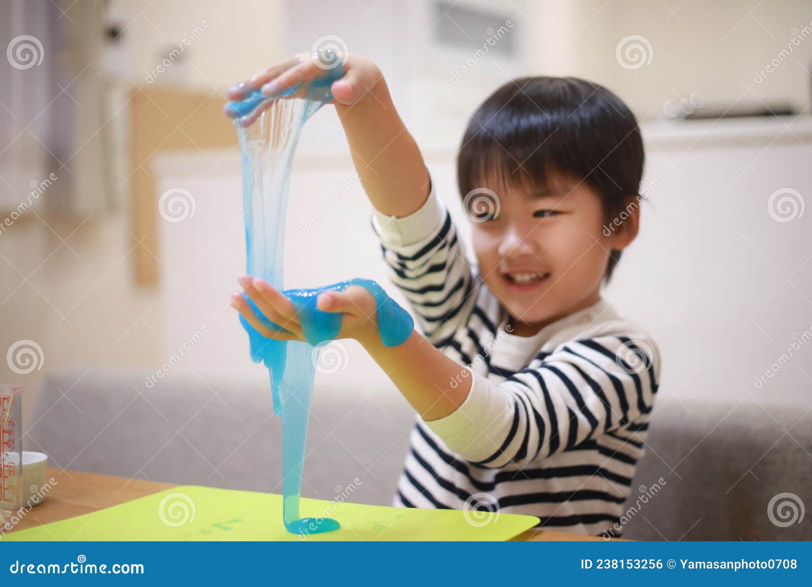 Image of a Boy Making Slime Stock Photo - Image of sitting, rooms ...