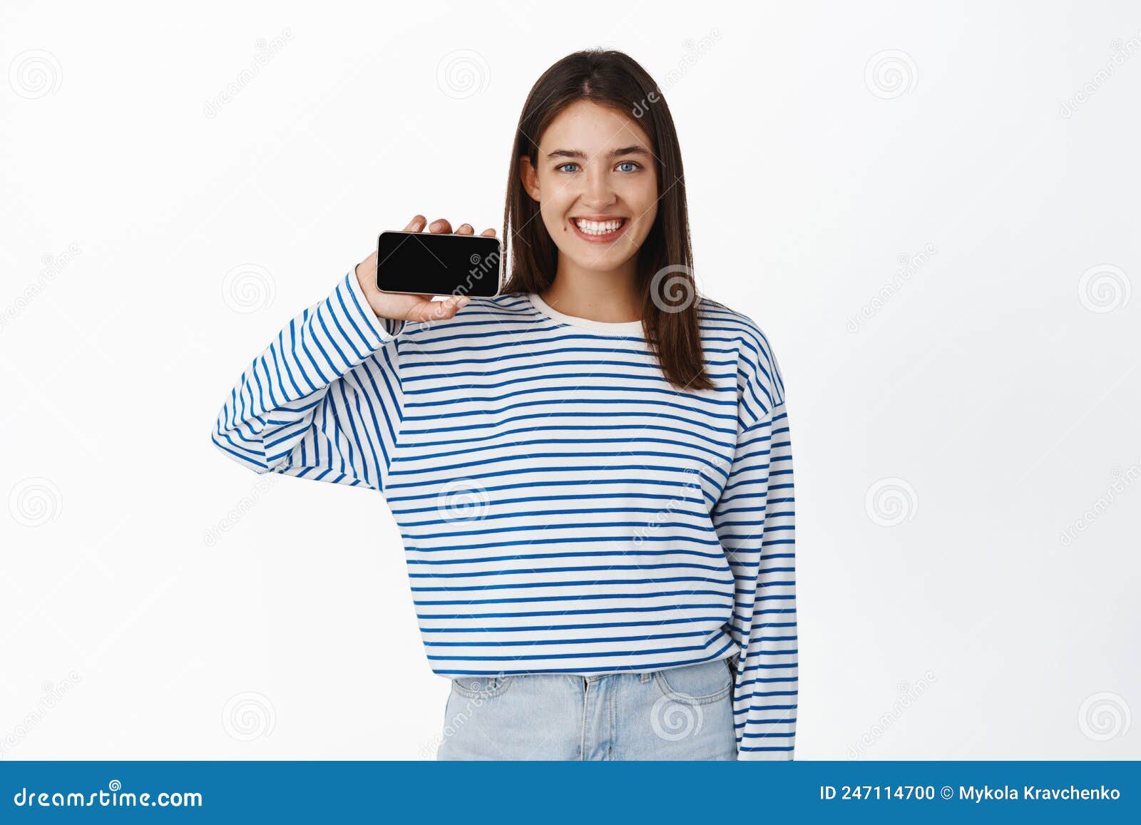 Image of Smiling Brunette Girl Showing Mobile Phone Screen, Horizontal ...