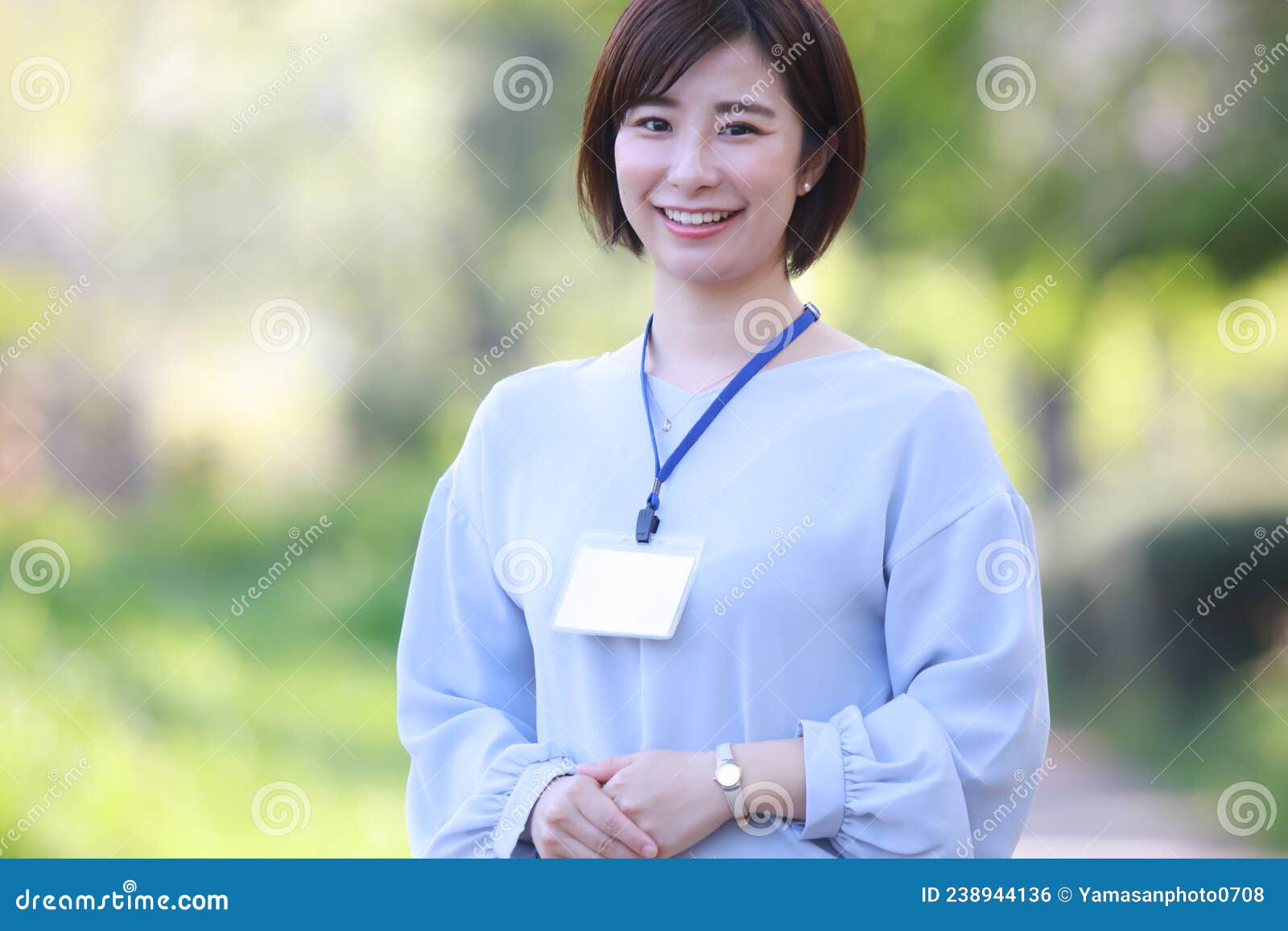 Image of a Smiling Female Employee Stock Photo - Image of dress, young ...
