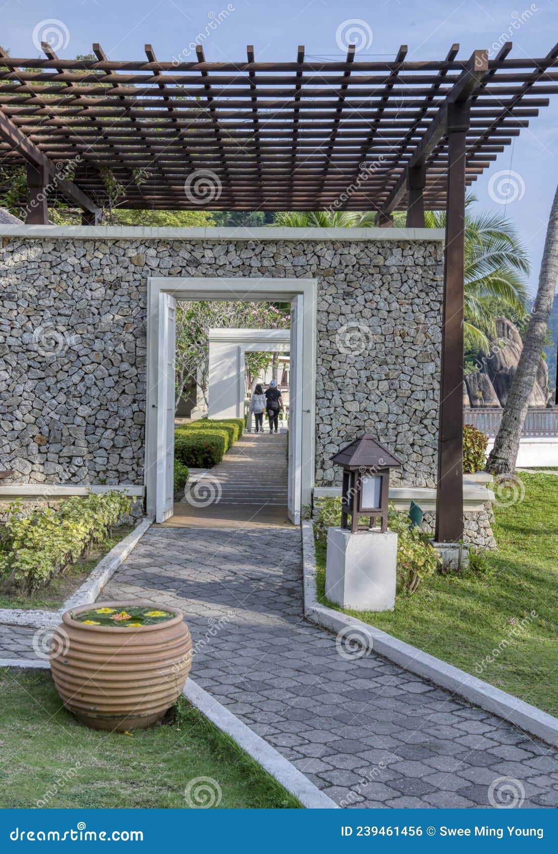 Square Pathway And Stairs Leading To The Porch With Pillars At The ...