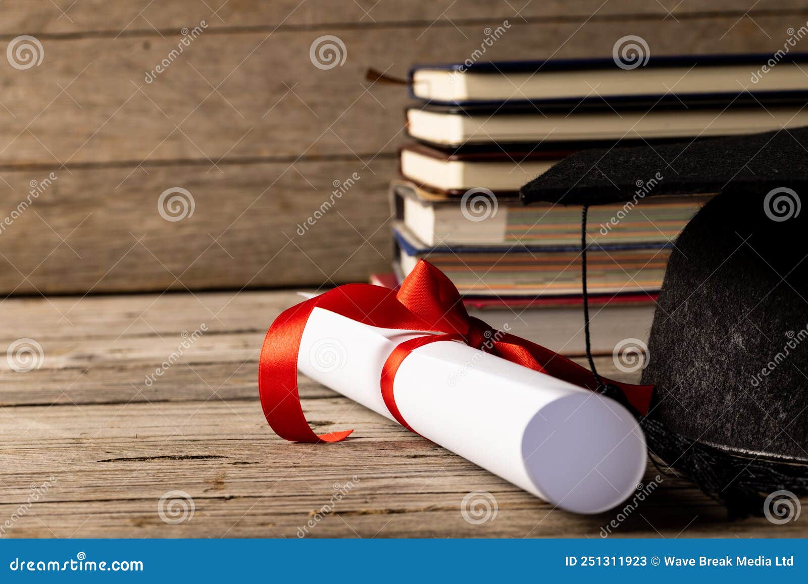 Image of Stack of Books and Diploma on Wooden Surface Stock Image ...