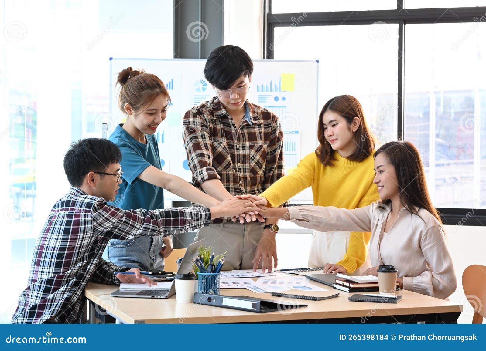 Image of Start Up Business Team Stacking Hands Together in Meeting Room ...