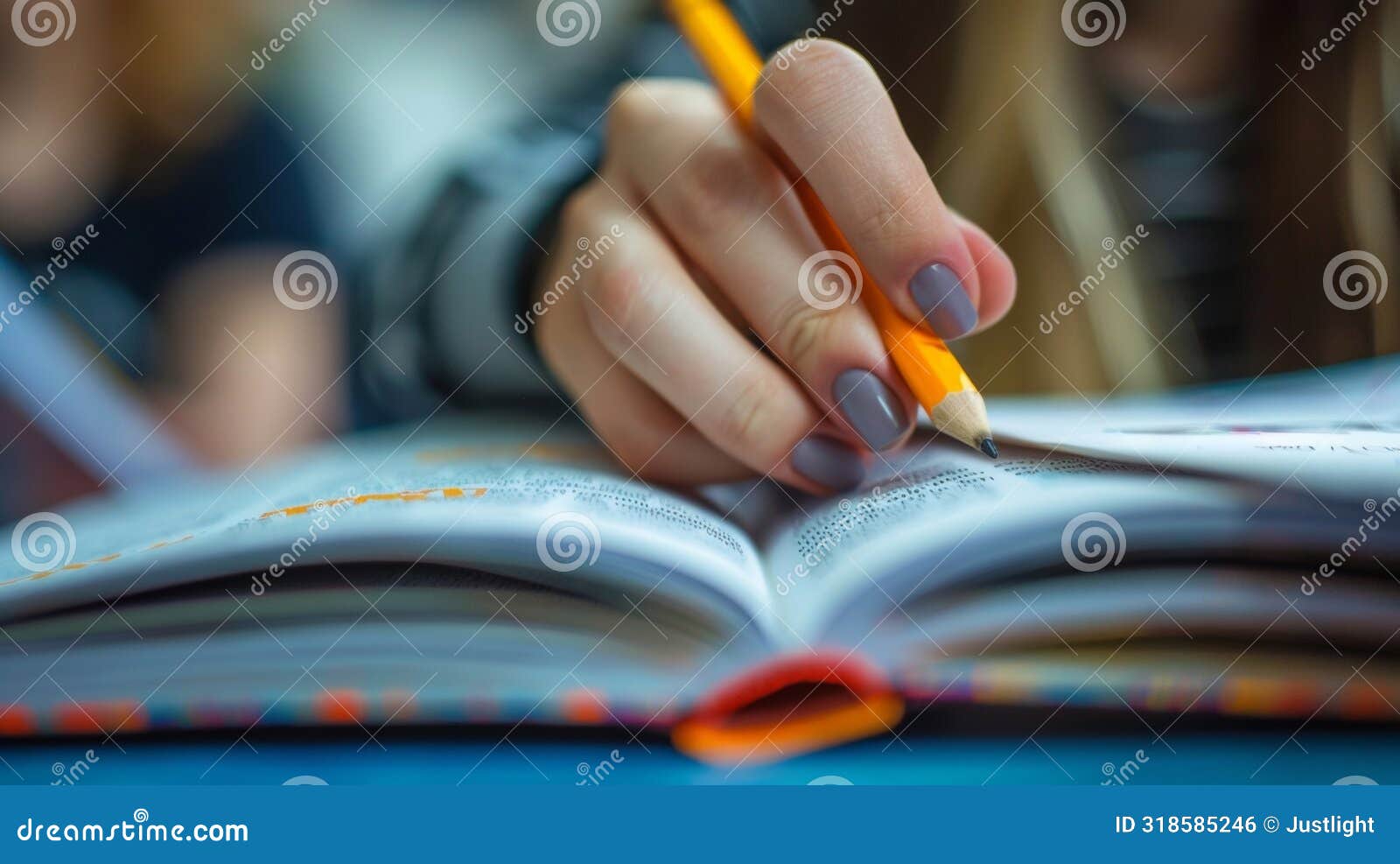 An Image of a Students Hand Flipping through Pages of a Health and ...