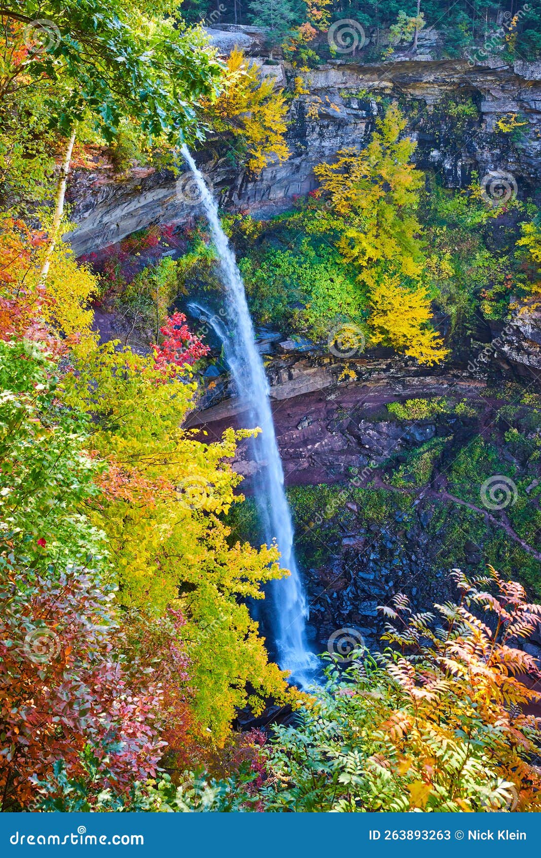 Stunning Tall Waterfall Over Cliffs is Surrounded by Colorful Peak Fall ...