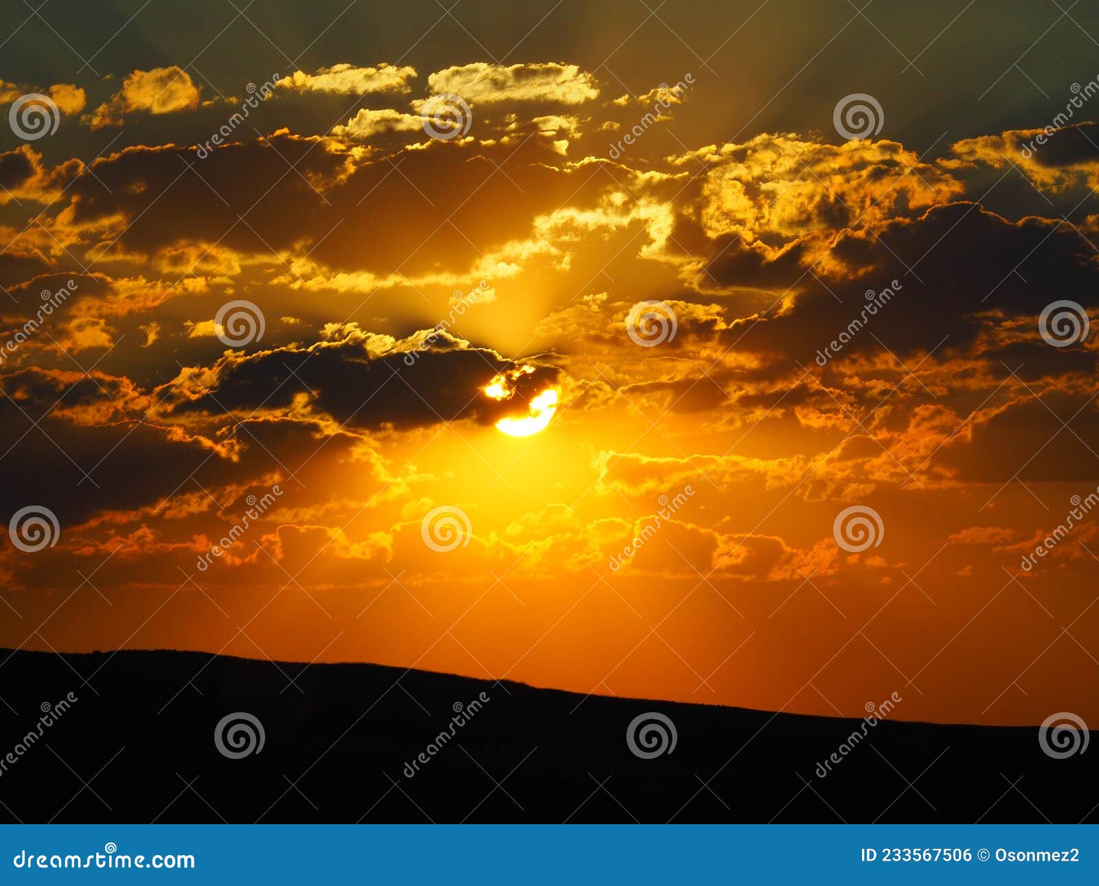 Image of Sunny Sky and Sunset Visible between Clouds Stock Photo ...
