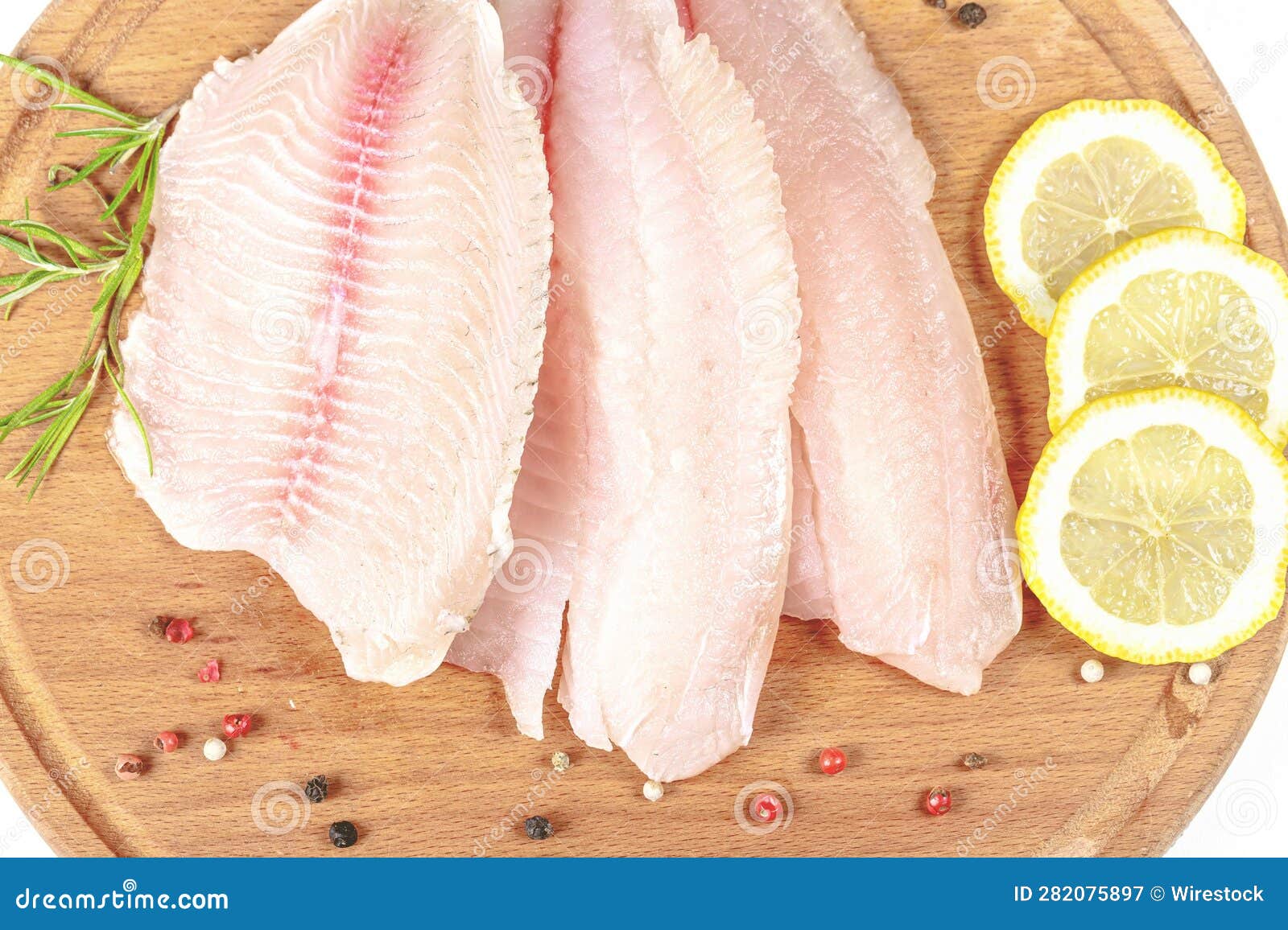 Image of Three Fish Fillets Arranged Side-by-side on a Plate Stock ...