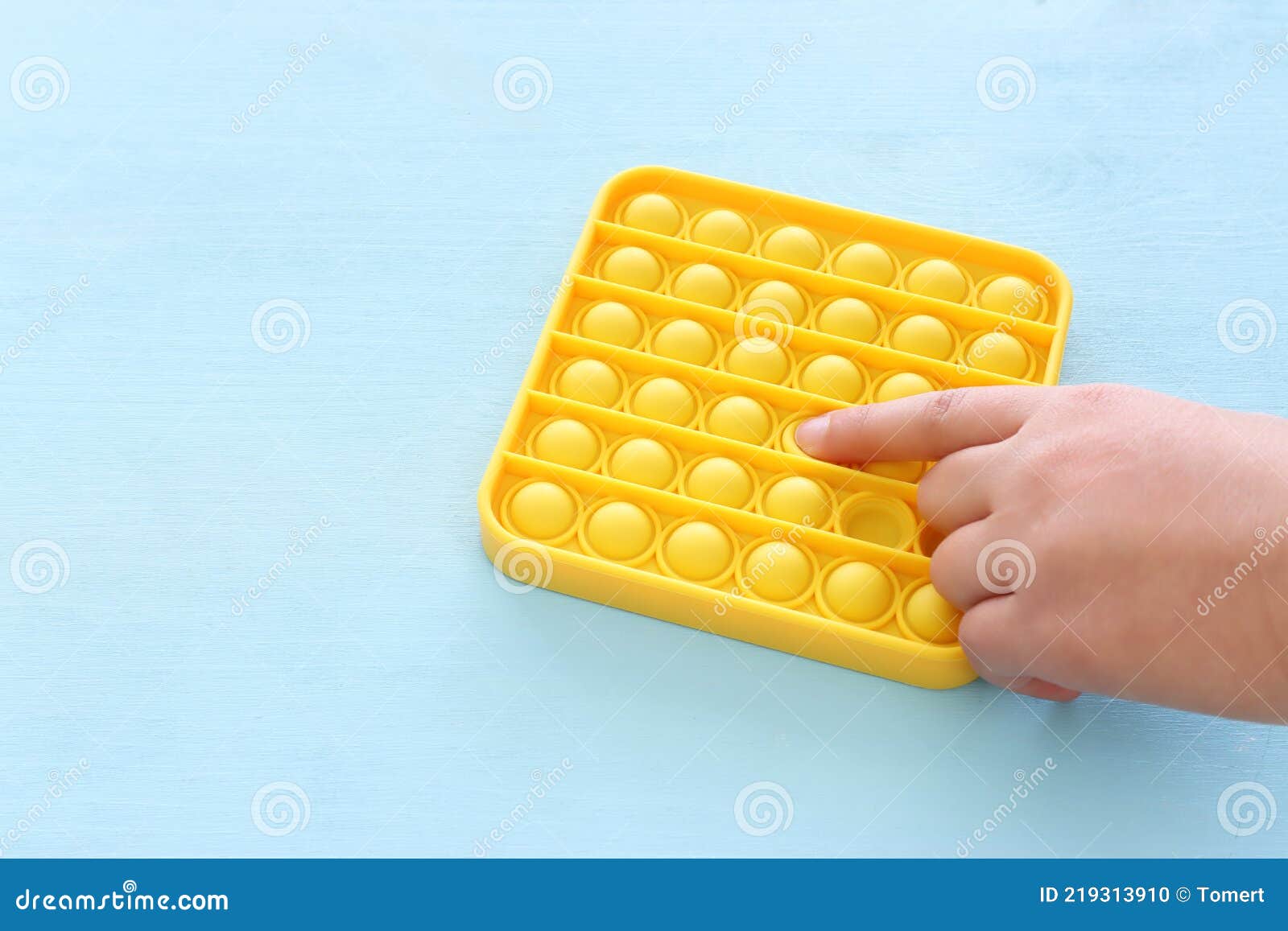 Image of Trendy Yellow Pop it Fidget Toy Stock Photo - Image of ...