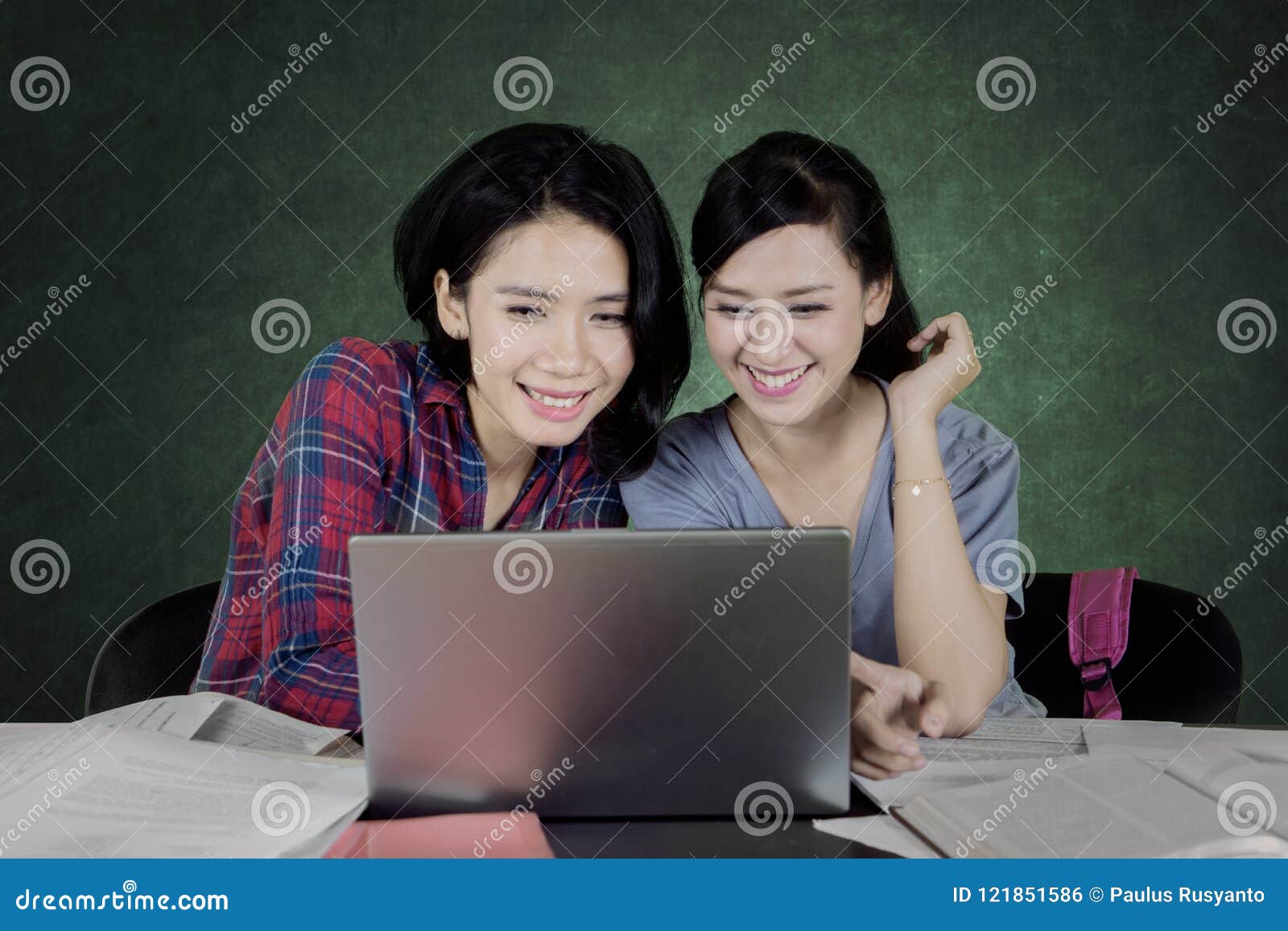 Two Female Students Using a Laptop in the Classroom Stock Photo - Image ...