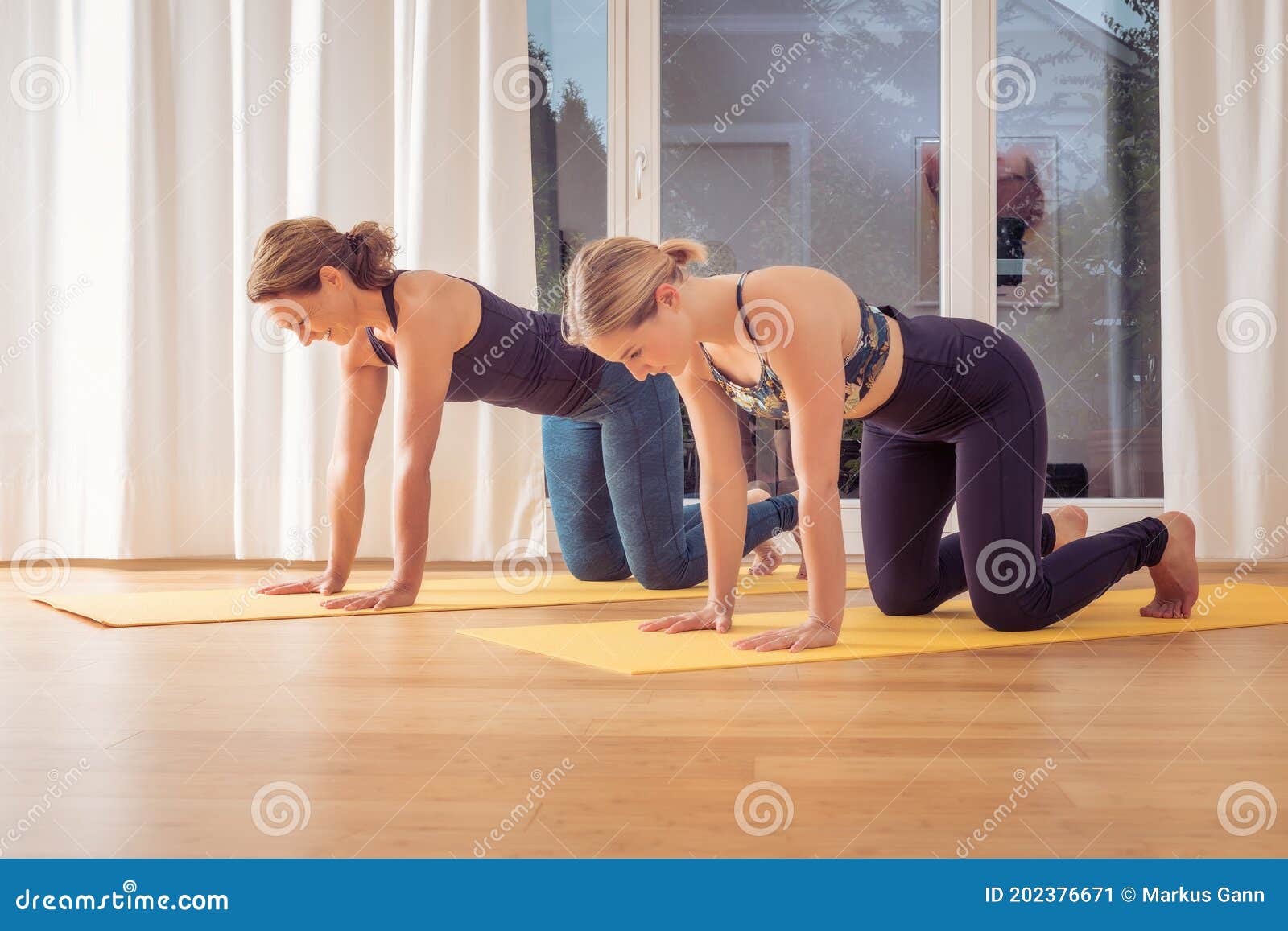 Two Women Doing Yoga at Home Stock Image - Image of instructor ...