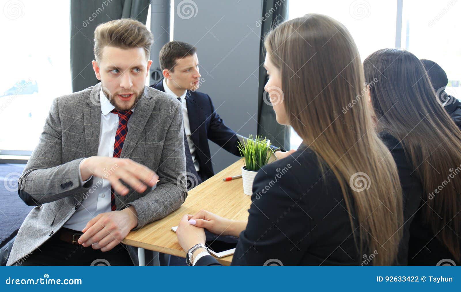 Image of Two Young Business People Interacting at Meeting in Office ...