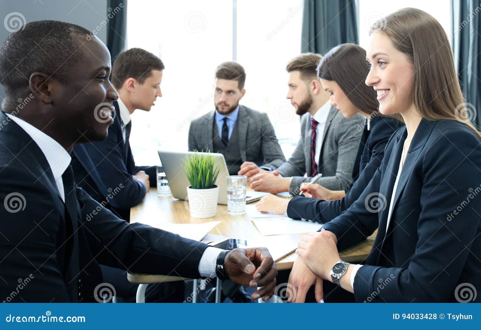Image of Two Young Business People Interacting at Meeting in Office ...