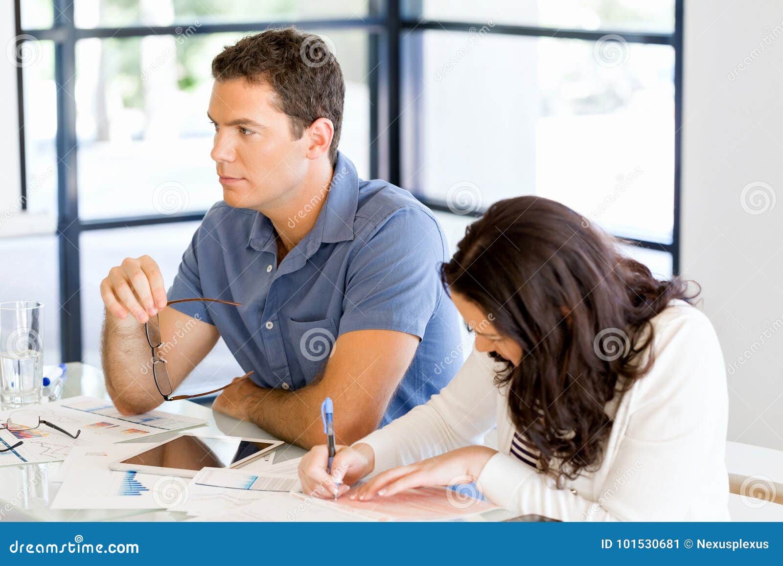 Image of Two Young Business People in Office Stock Image - Image of ...