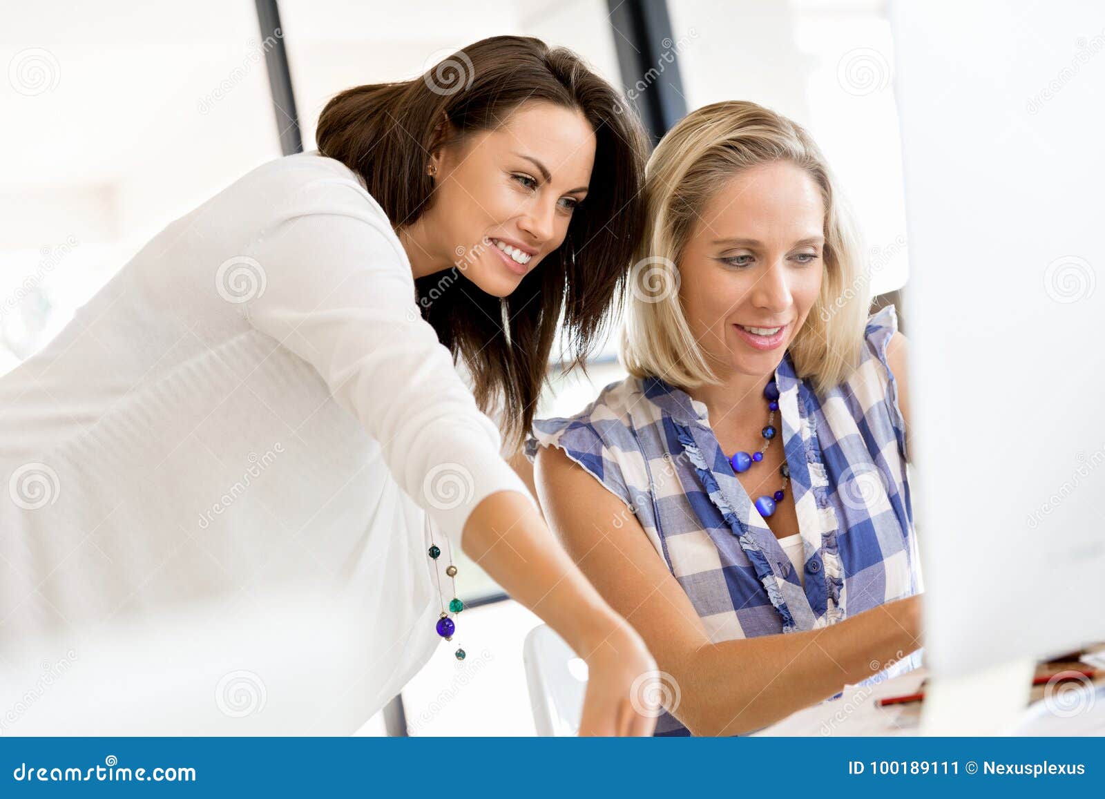 Image of Two Young Business Women in Office Stock Image - Image of ...