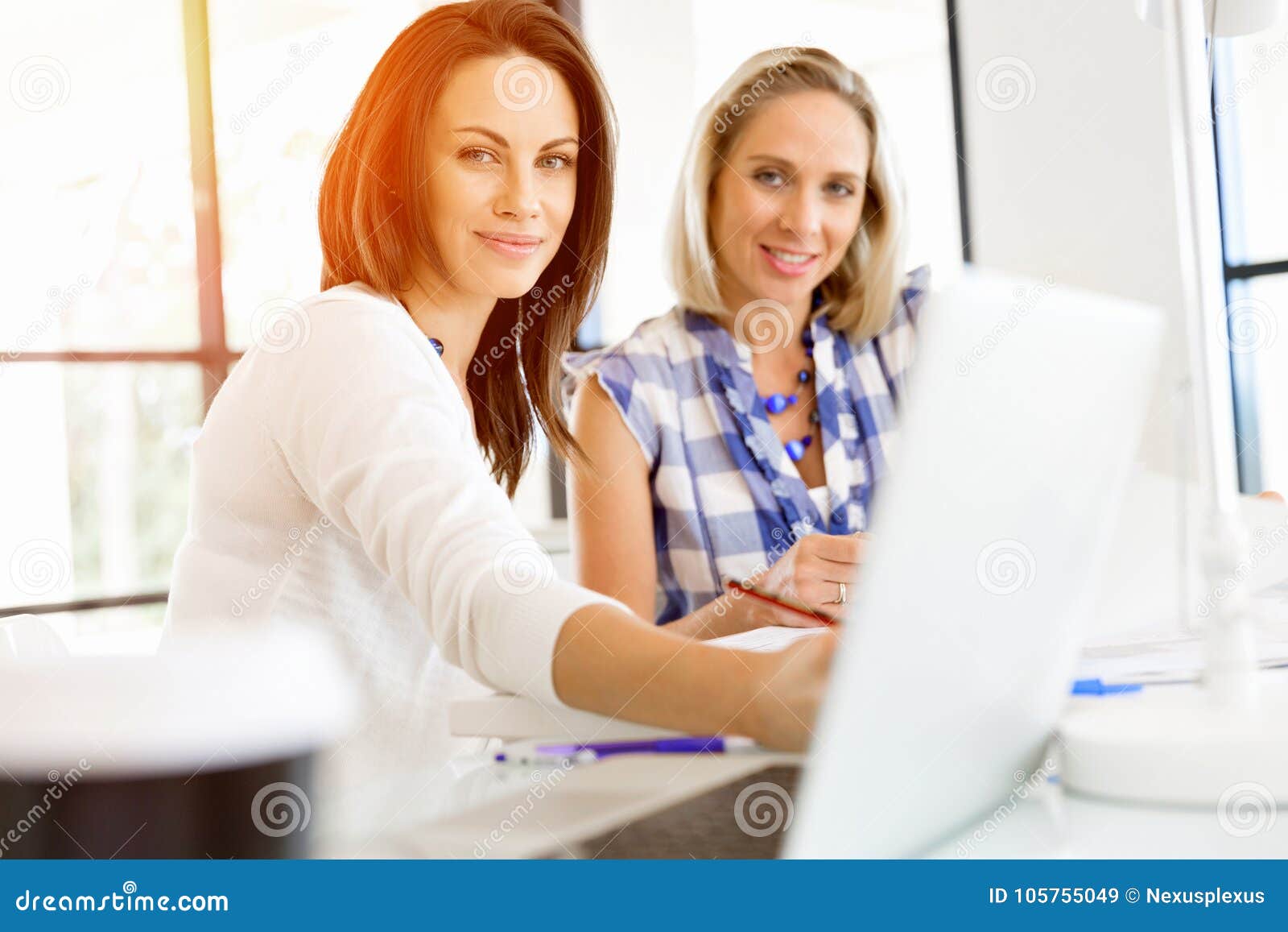 Image of Two Young Business Women in Office Stock Image - Image of ...