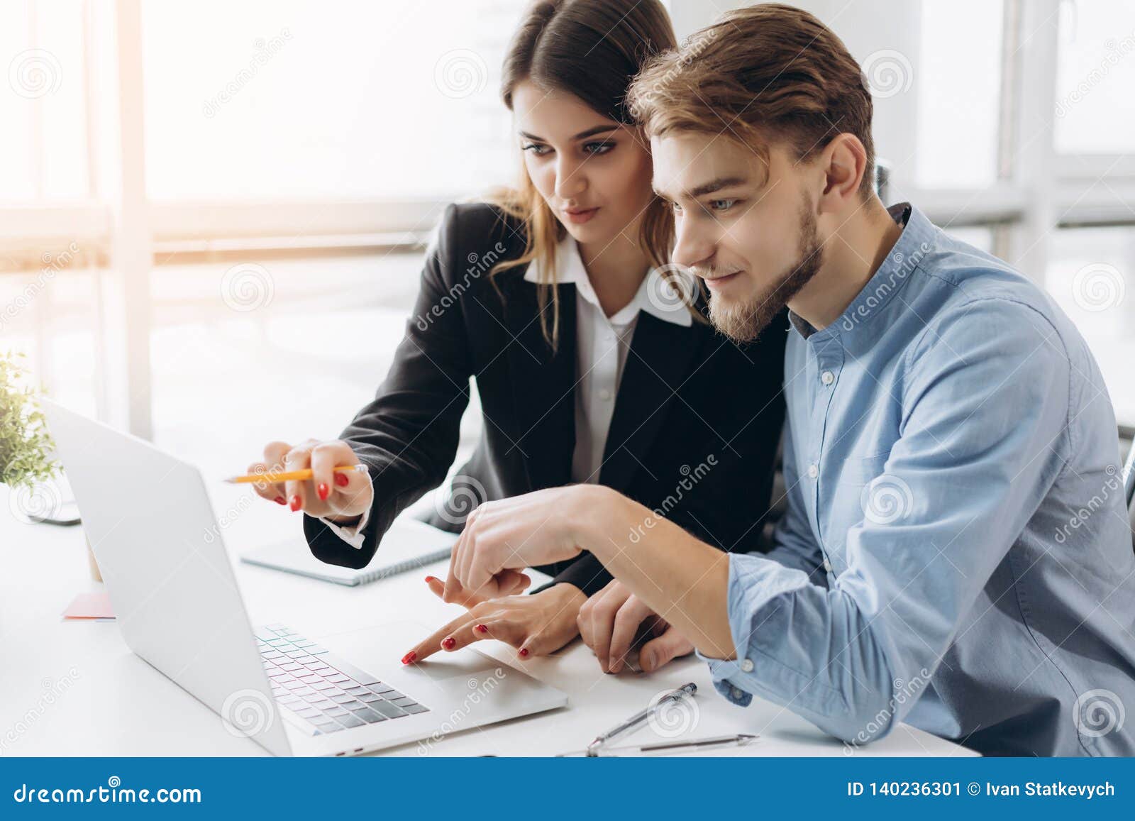 Image of Two Young Business Workers Working Together on Project at ...