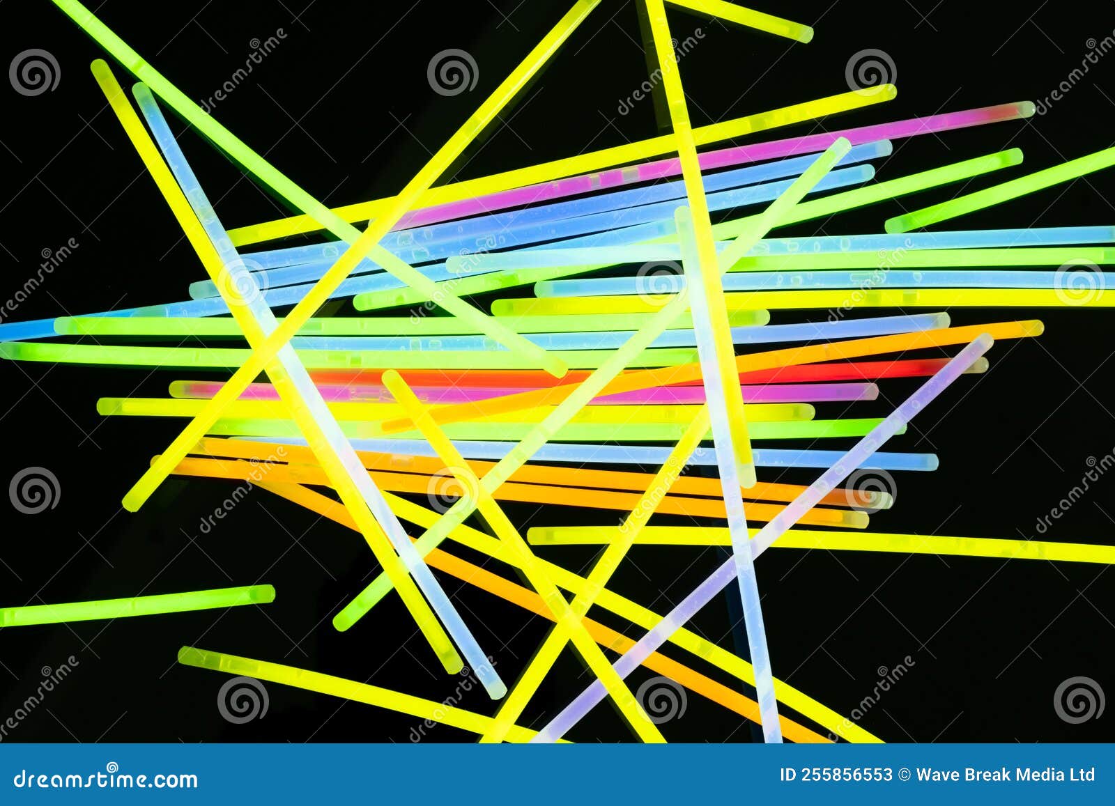 Image of Vibrant Stack of Neon Glow Sticks Scattered Over Black ...