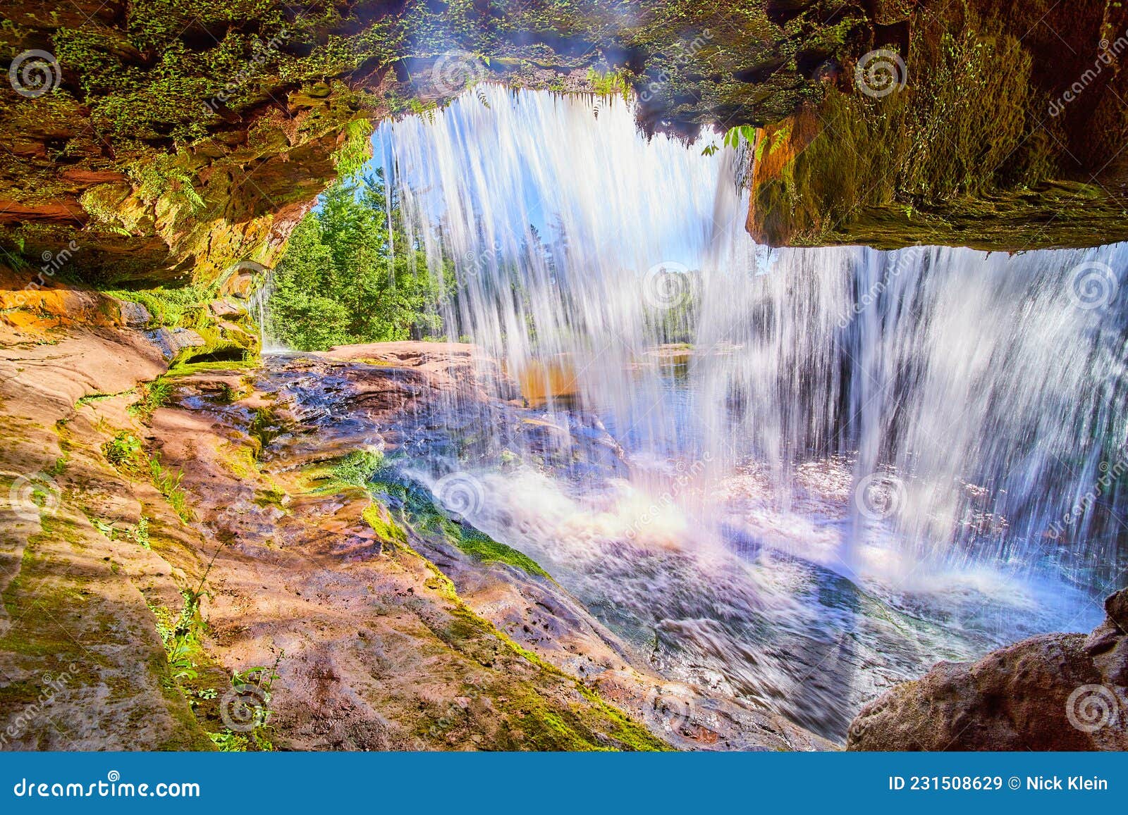 View Behind and Inside of Waterfall Cave of Orange and Lichen Growth ...