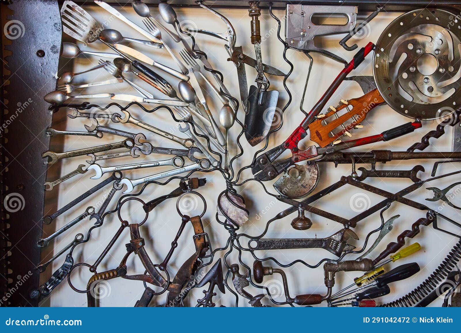 Wall of Interconnecting Tools and Assorted Metal Objects Connected by ...