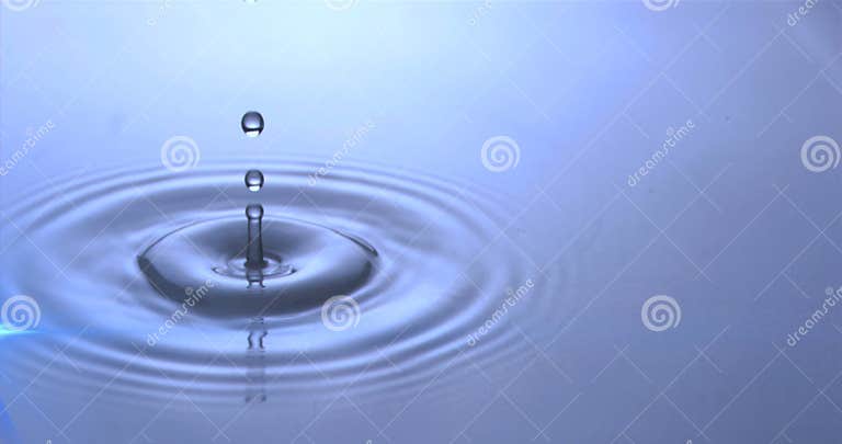 Image of Water Drops Dropping into Blue Water with Glowing Light Stock ...