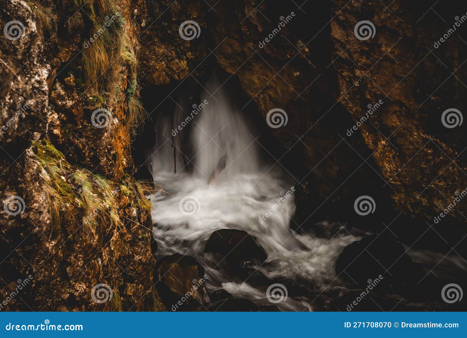Water that is Flowing Out of a Cave with Moss on it Stock Photo - Image ...