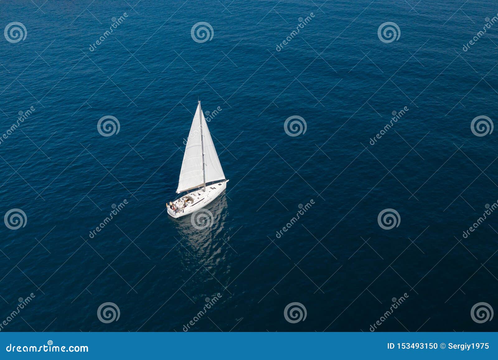 White Sailing Yacht in the Blue Sea Top View Stock Photo - Image of ...