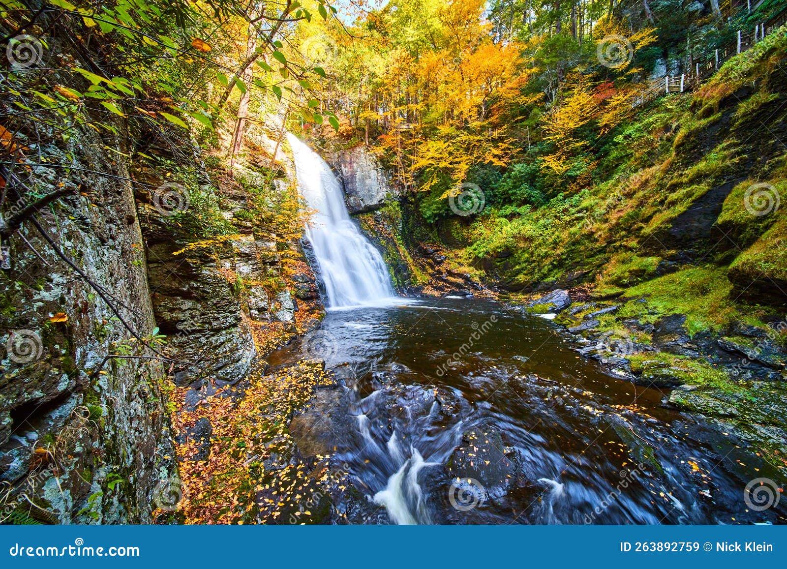 Wide Angle Gorge with Cliffs, Moss, Fall Leaves, and Raging Waterfall ...