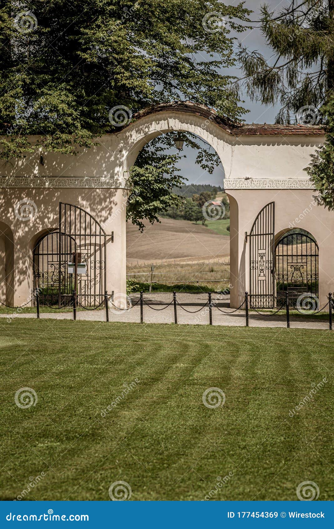 Image of a Wide Open Gate of a Park with a Manicured Lawn Stock Image ...