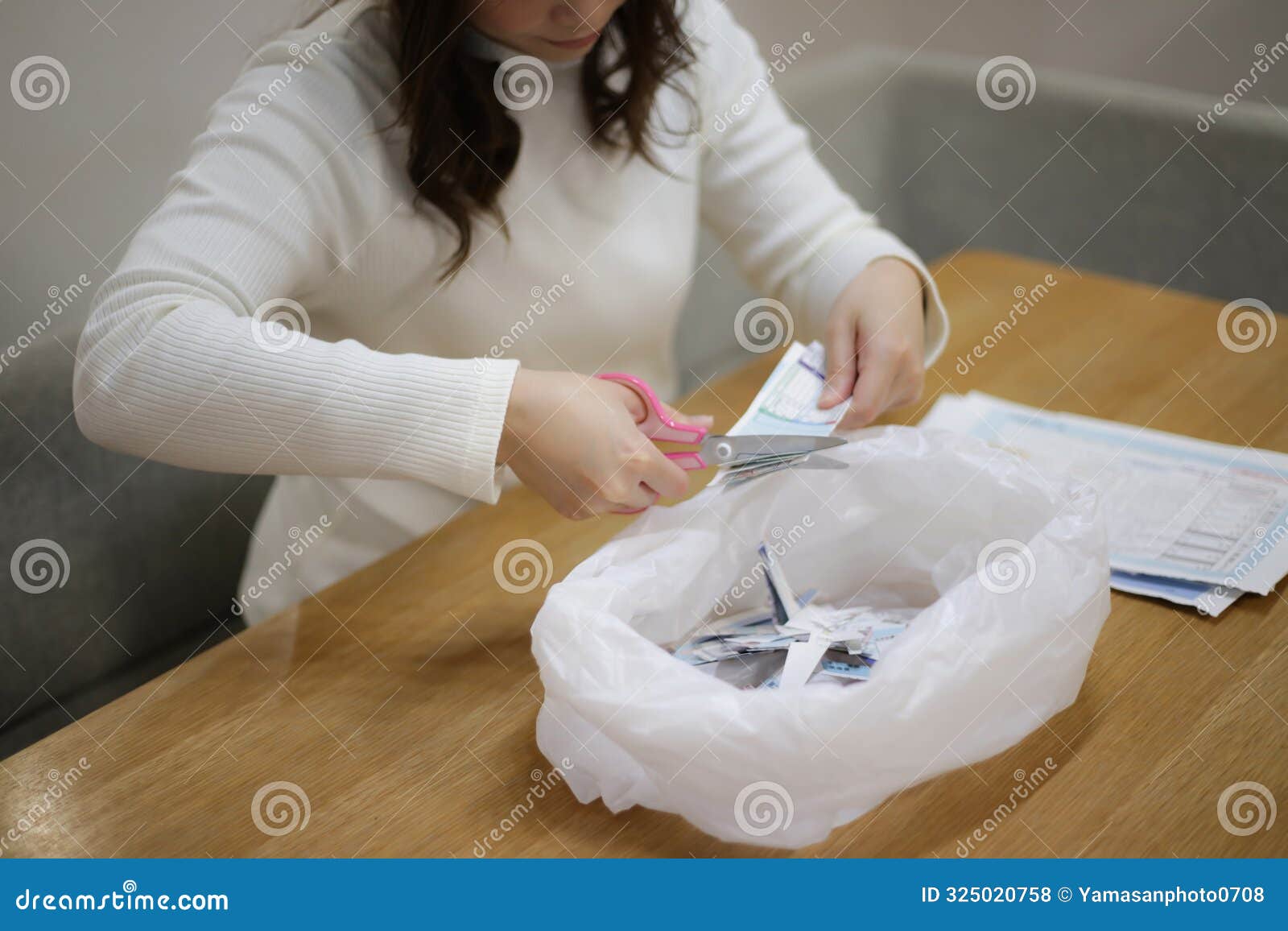 A Woman Cutting Documents with Scissors Stock Photo - Image of house ...