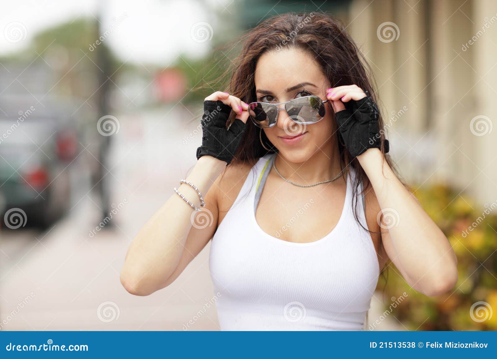 Image of a Woman Removing Her Glasses Stock Photo - Image of brunette ...