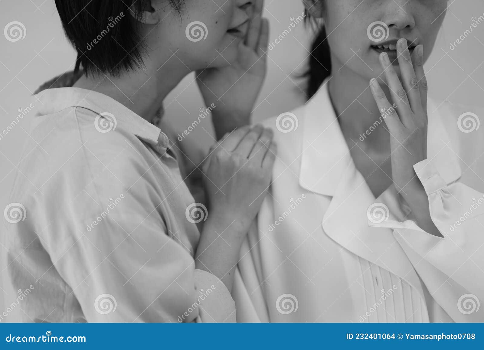 A woman who talks secretly stock photo. Image of business - 232401064