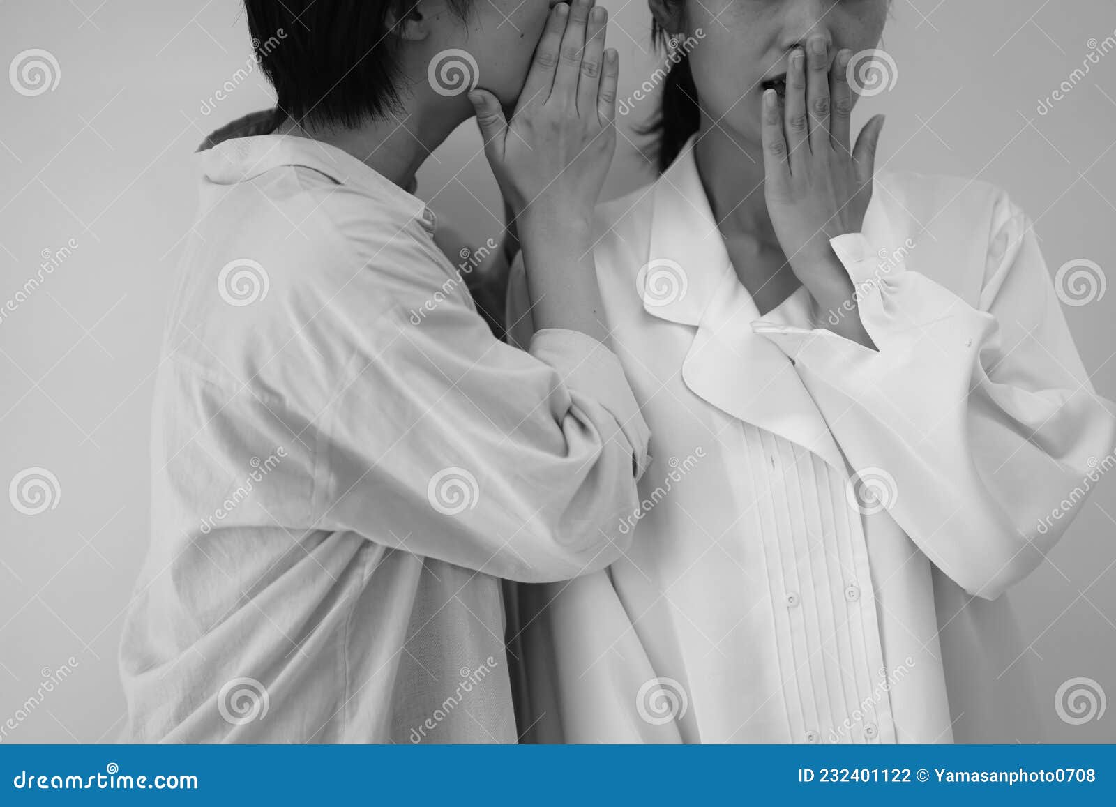A woman who talks secretly stock photo. Image of white - 232401122