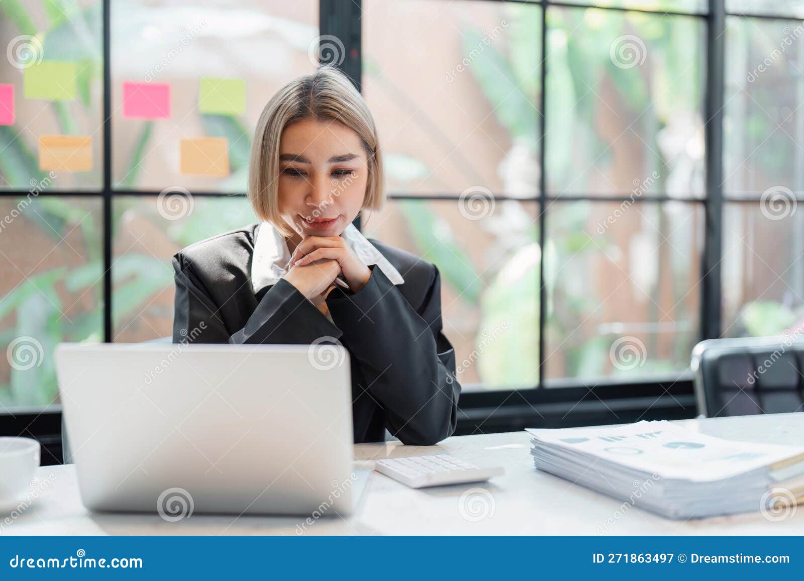 Image of Woman Thinking and Down Working Sitting at Table at Office ...