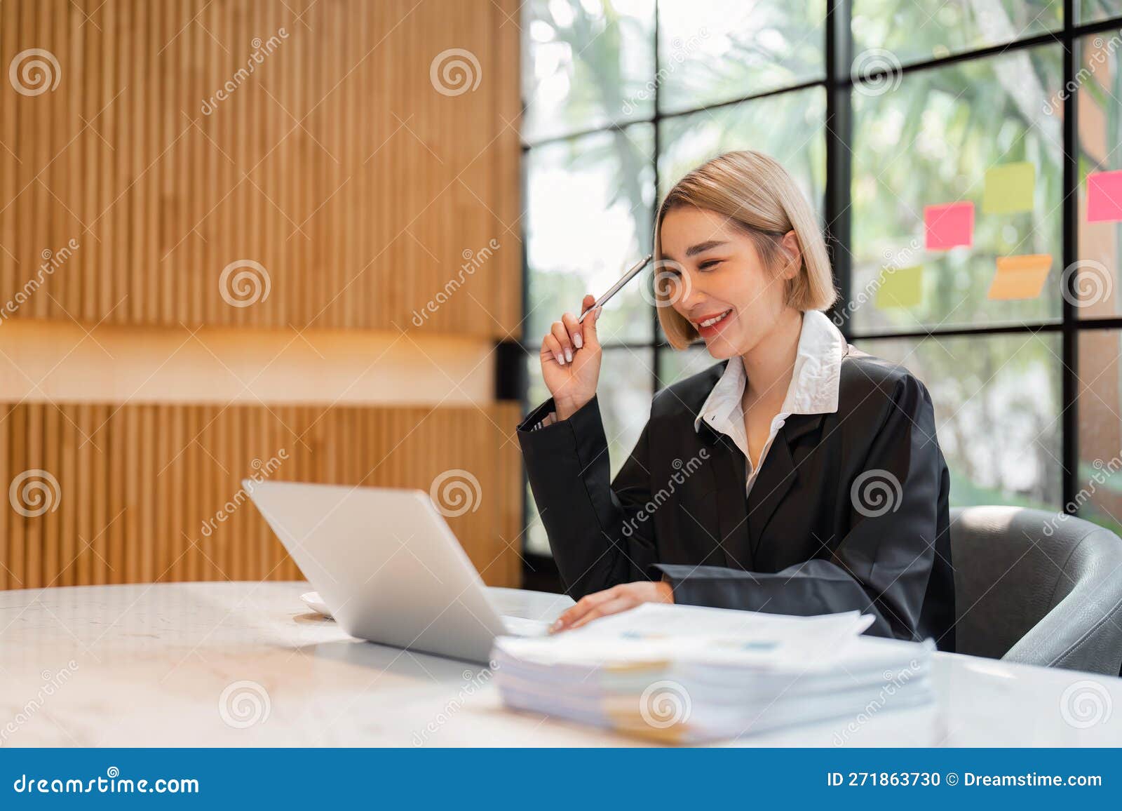 Image of Woman Thinking and Down Working Sitting at Table at Office ...