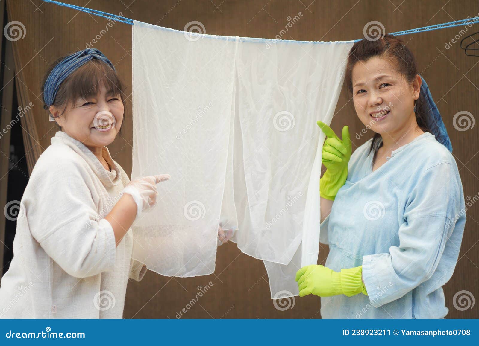 Woman drying silk stock image. Image of home, living - 238923211