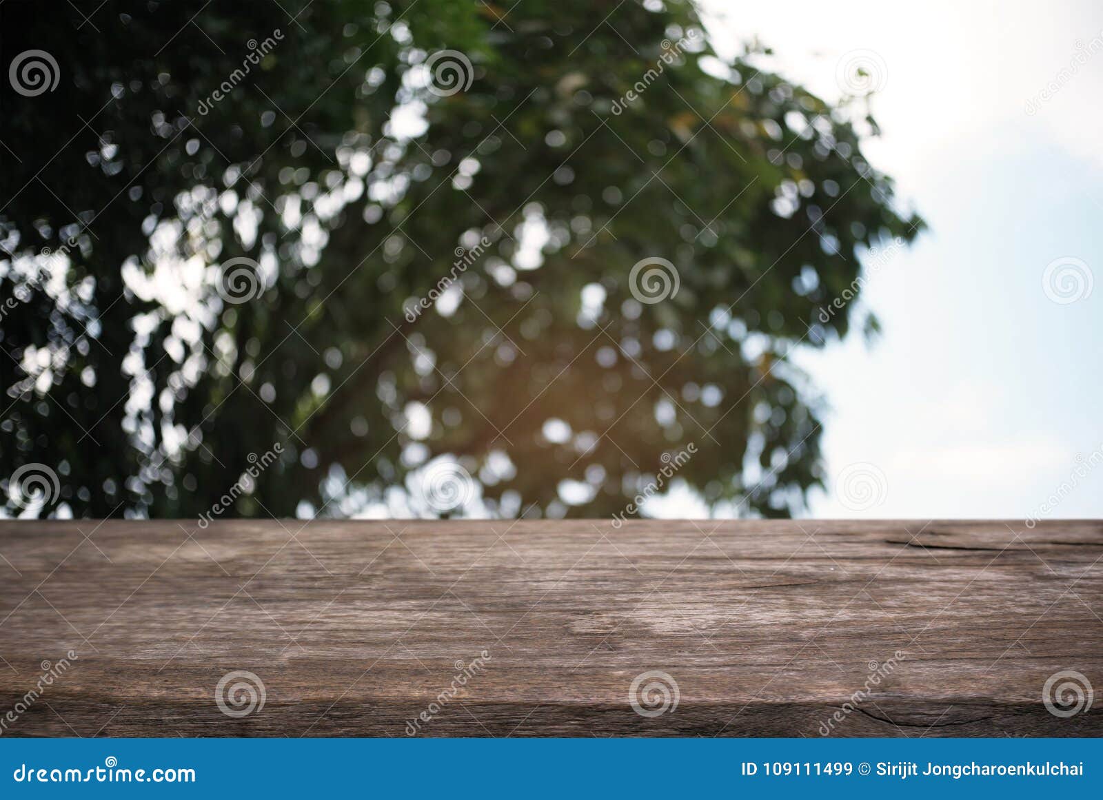 Image of Wooden Table in Front of Abstract Blurred Background of Stock ...
