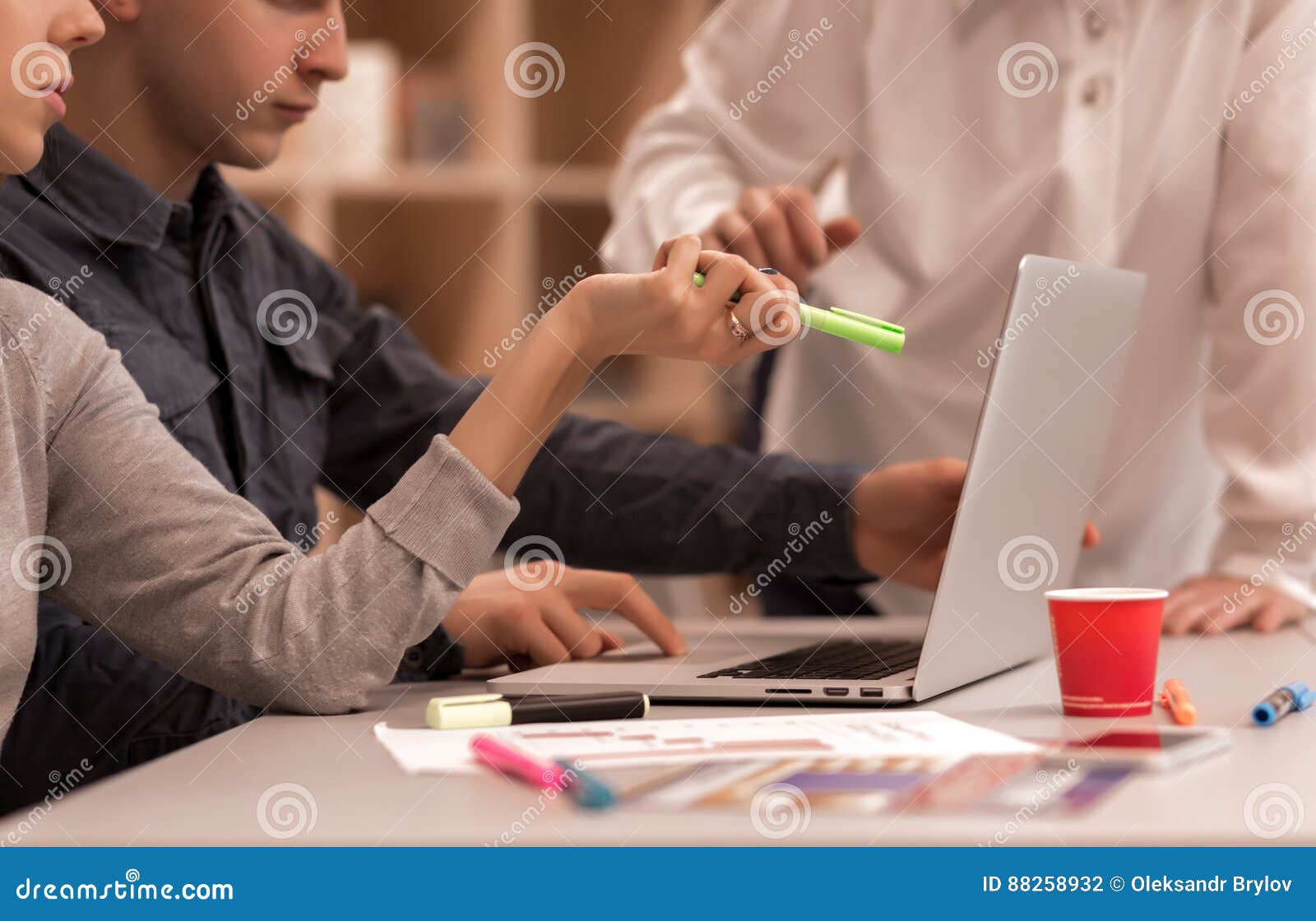 Image of Young Business Team Discussing Project at Computer Stock Photo ...