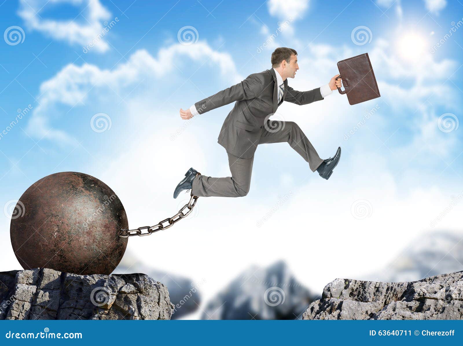Image of Young Businessman Jumping Over Gap Stock Image - Image of ...